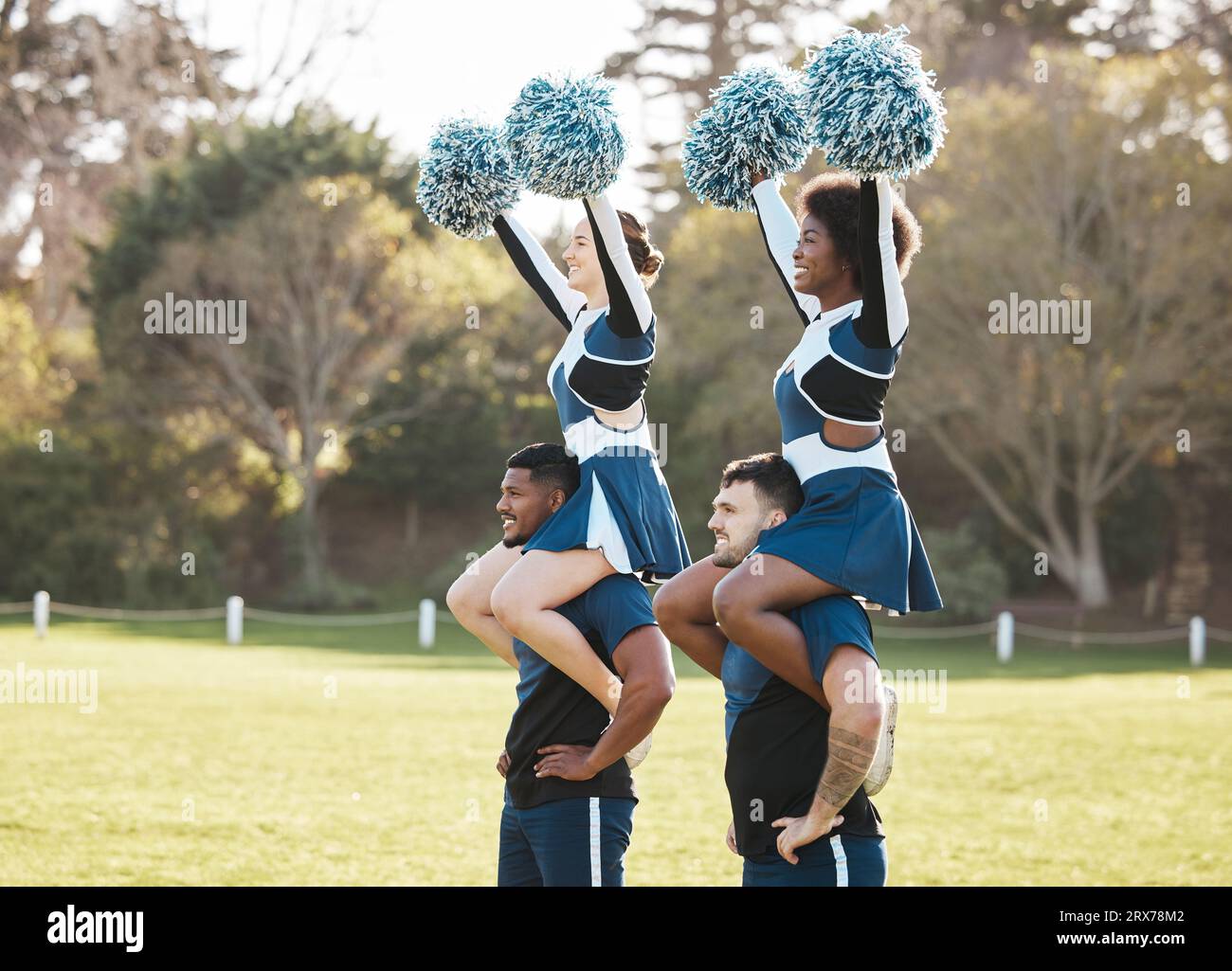 Cheerleader, sports and men carry women on field for performance, dance ...