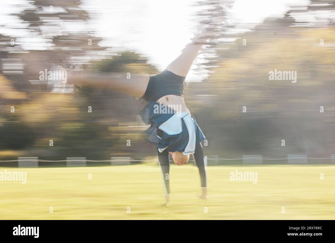 Cheerleader routine, cartwheel and field person exercise, action and ...