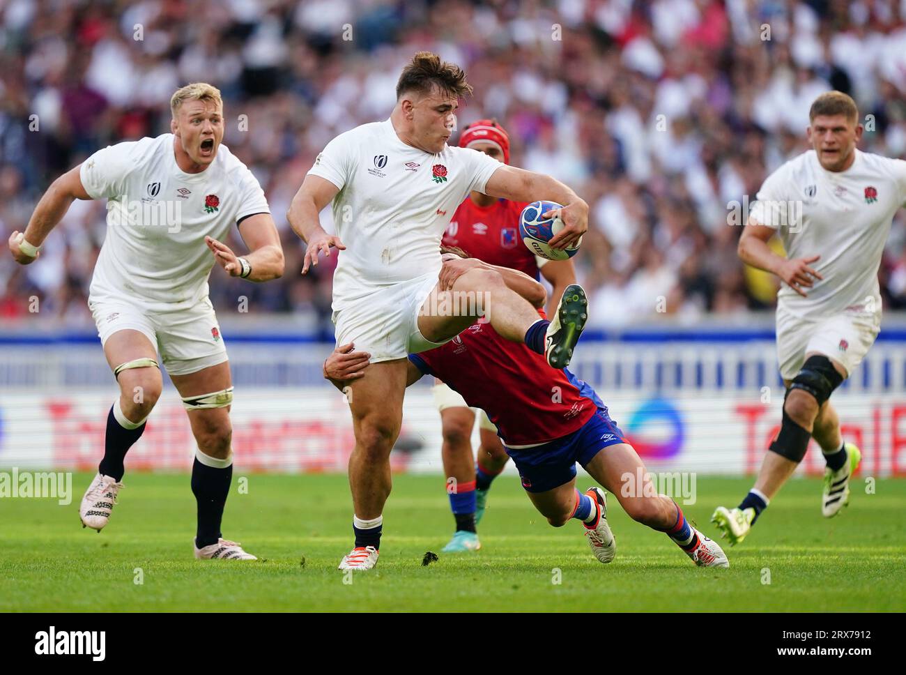 England's Theo Dan is tackled by Chile's Benjamin Videla during the ...