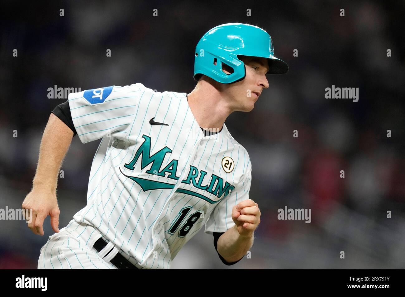 Miami Marlins' Joey Wendle (18) runs after hitting a single during the ...