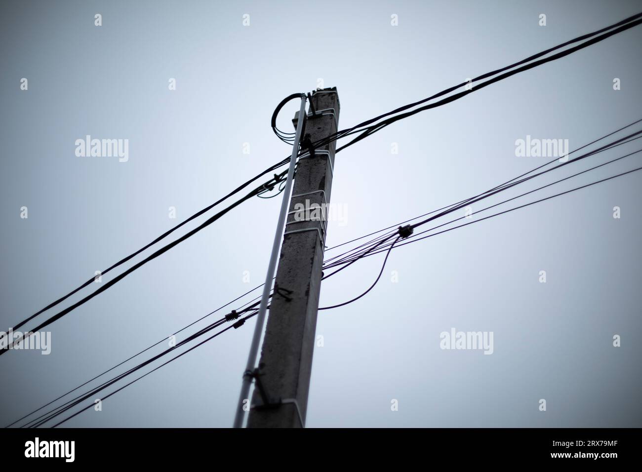 Pole with wires. Concrete pole with electricity. Infrastructure in city ...