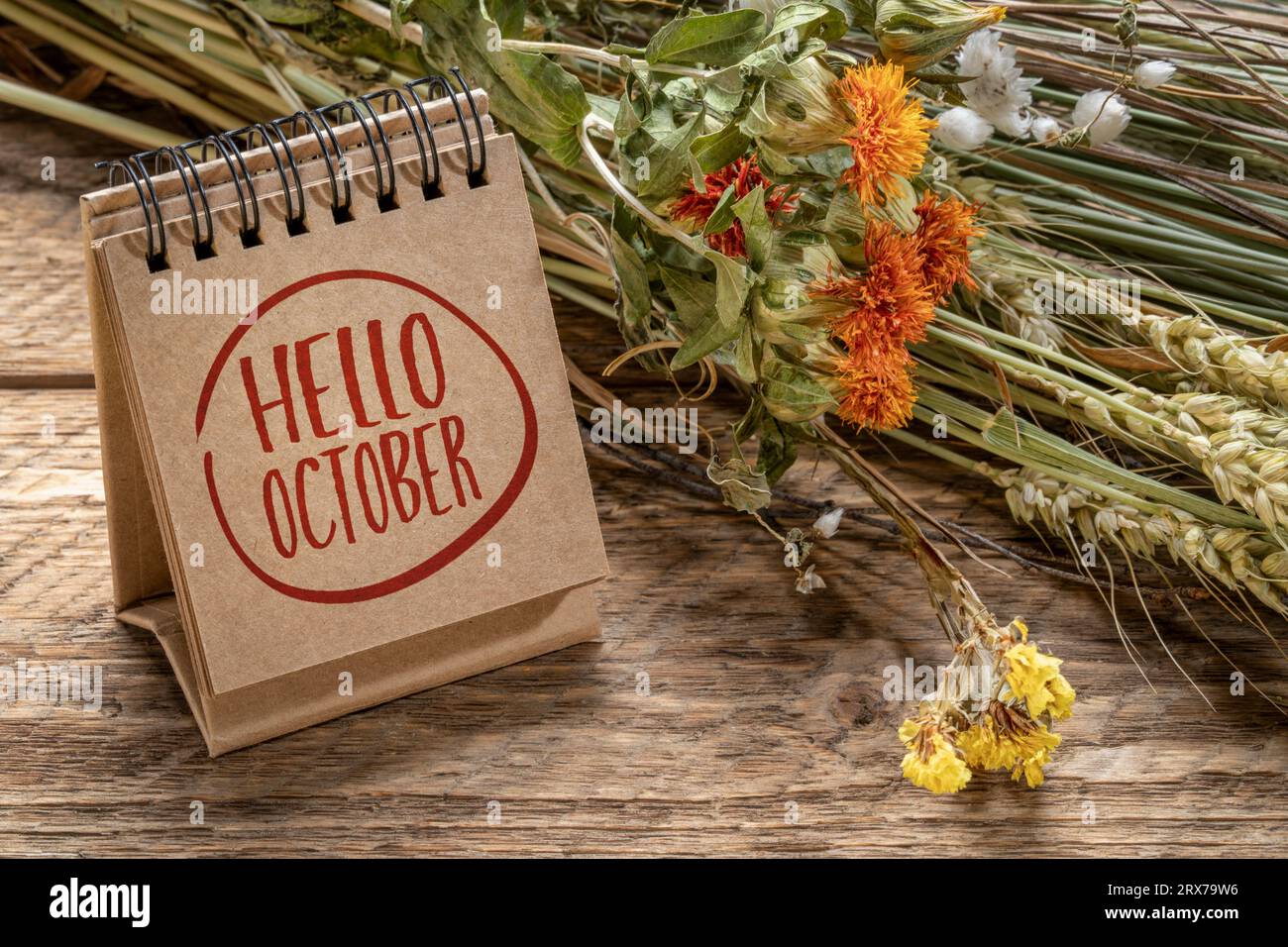 Hello October welcome note in a spiral desktop calendar with floral ...