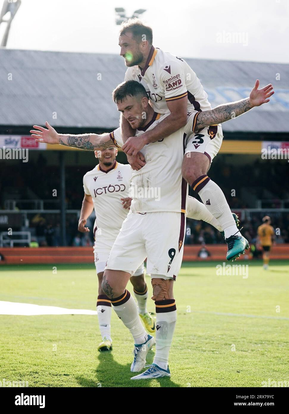 Bradford City's Andy Cook (centre) celebrates after scoring a hat-trick ...
