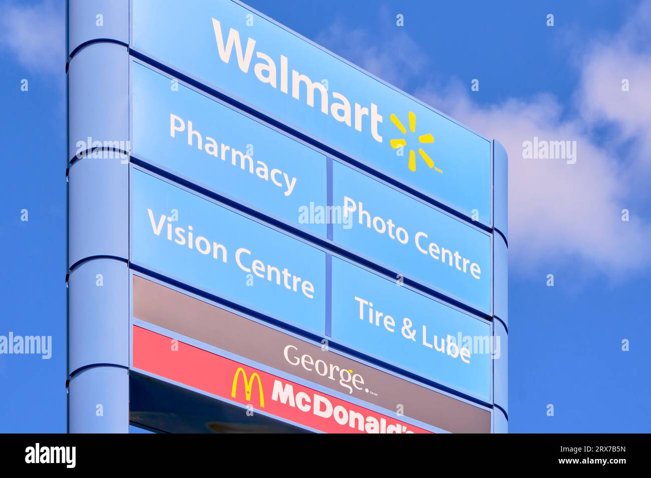 Sign roadside at a Walmart Supercentre listing services available Stock ...