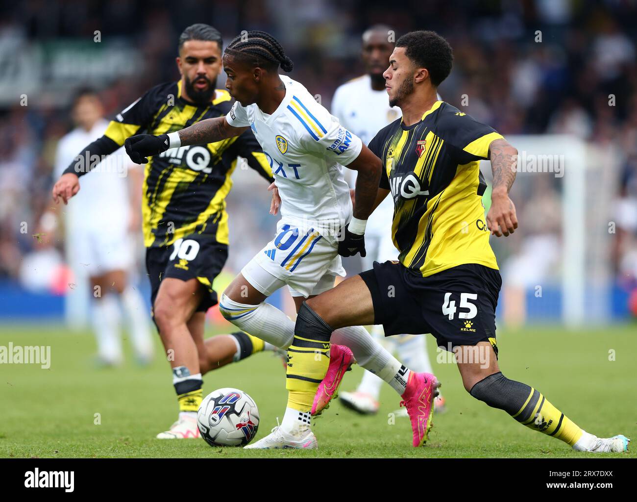 Leeds United's Crysencio Summerville (left) and Watford’s Ryan Andrews ...