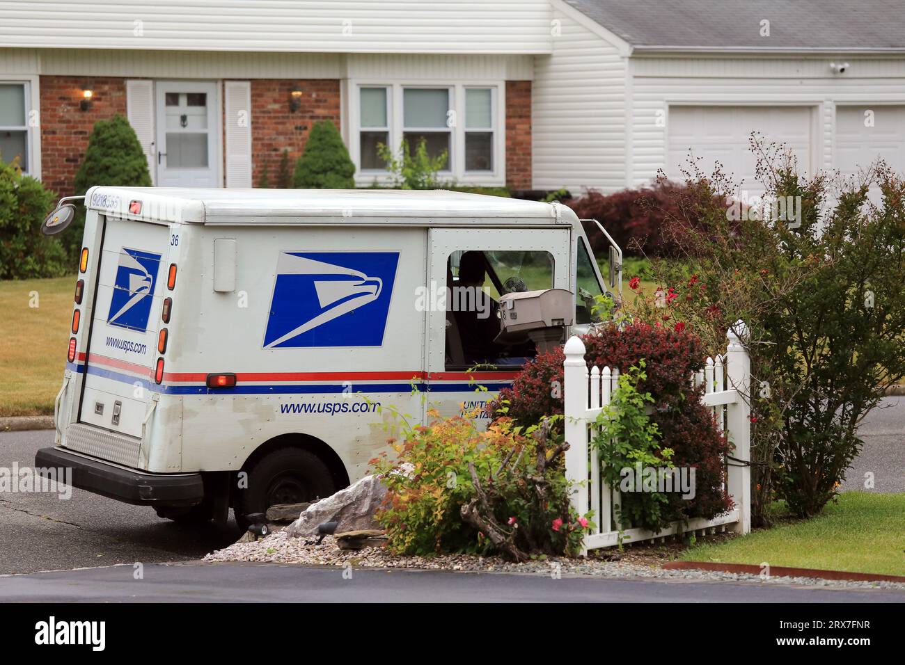 Postal truck delivering mail Long Island, NY Stock Photo - Alamy