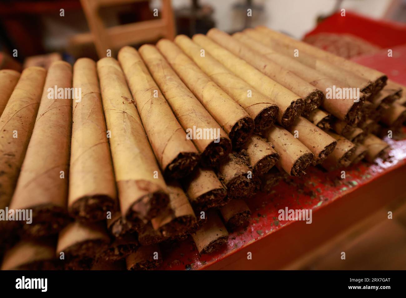 Close up of luxury hand made cigars stacked in a storage box. Tobacco ...