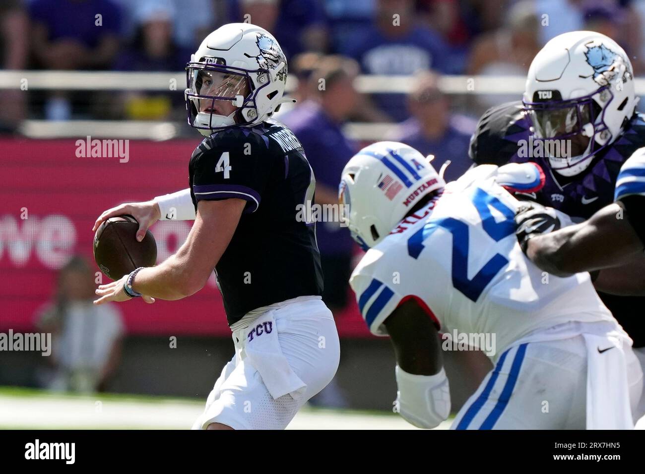 TCU quarterback Chandler Morris (4) looks to pass as SMU linebacker ...