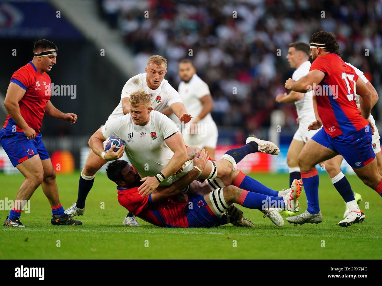 England's David Ribbans is tackled by Chile's Pablo Huete (left) during ...