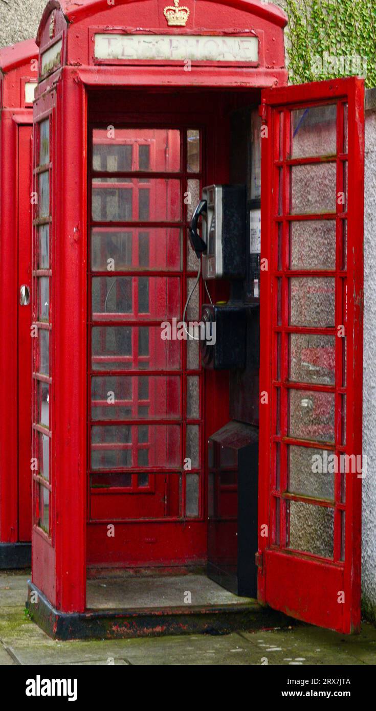 Battered old red phone box, public telephone kiosks are rarely used in ...