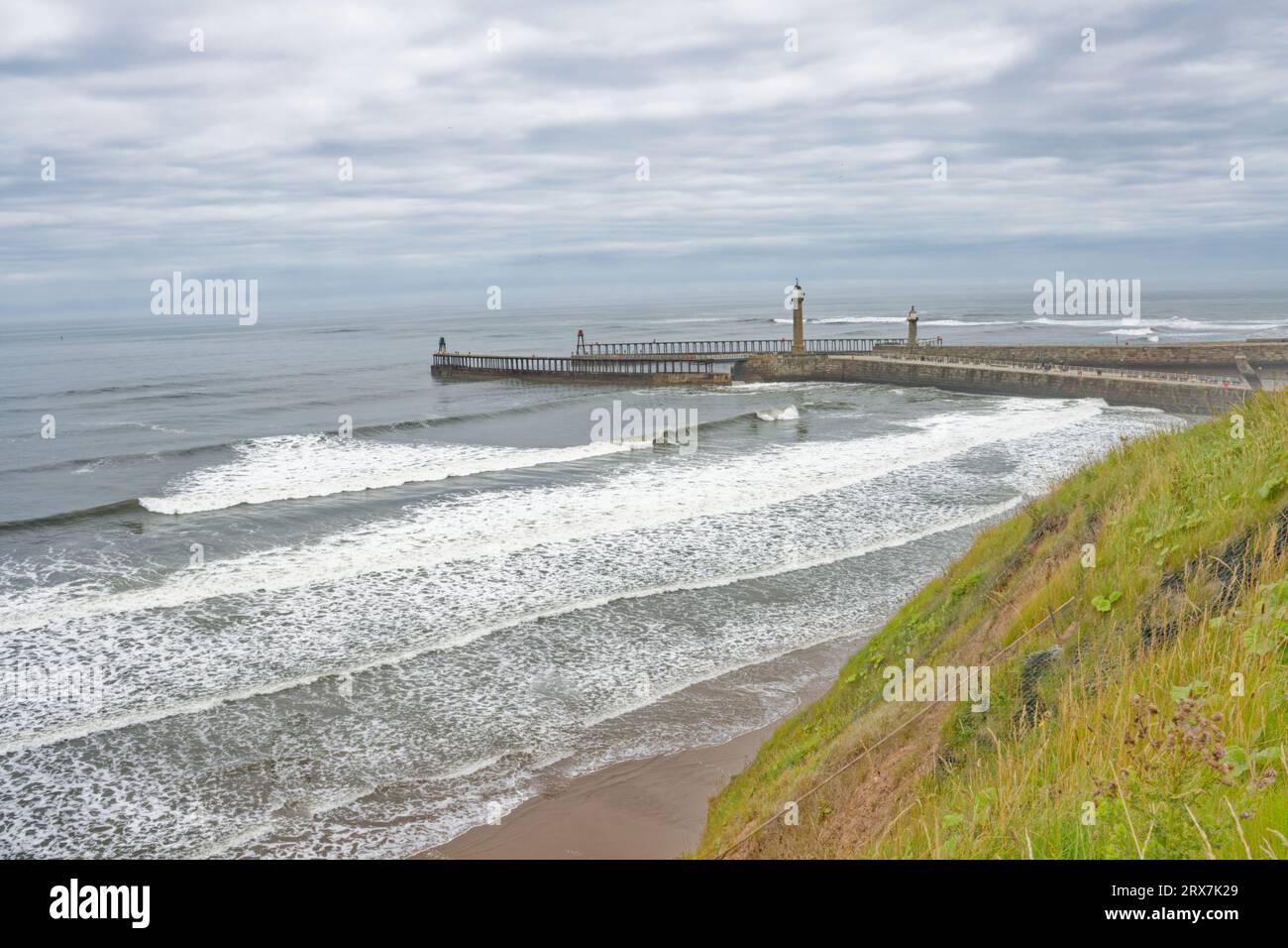 Whitby,England,9,August,2023.The Picture Shows ,The East and West Piers ...