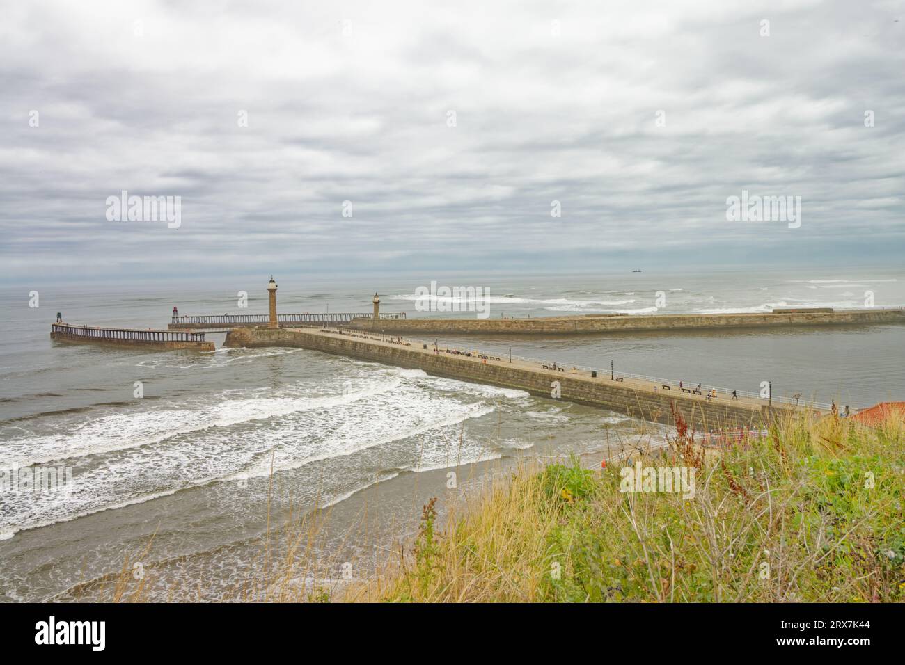 Whitby,England,9,August,2023.The Picture Shows ,The East and West Piers ...