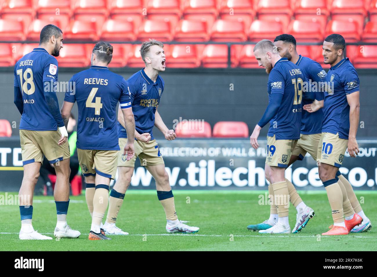 Jack Currie of AFC Wimbledon (C) celebrates scoring their side's second ...
