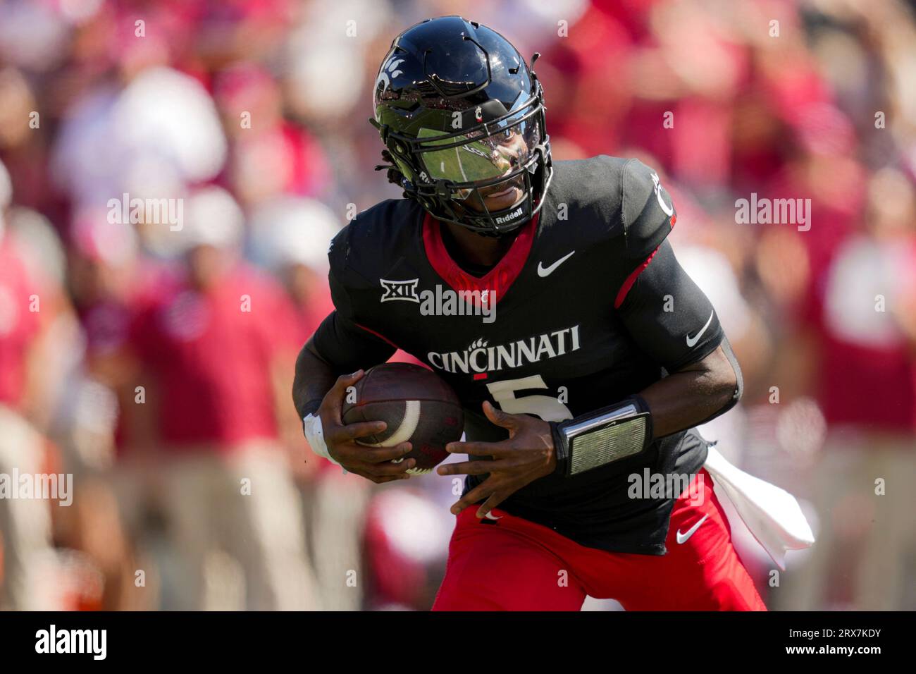 Cincinnati quarterback Emory Jones runs with the ball as he looks to ...