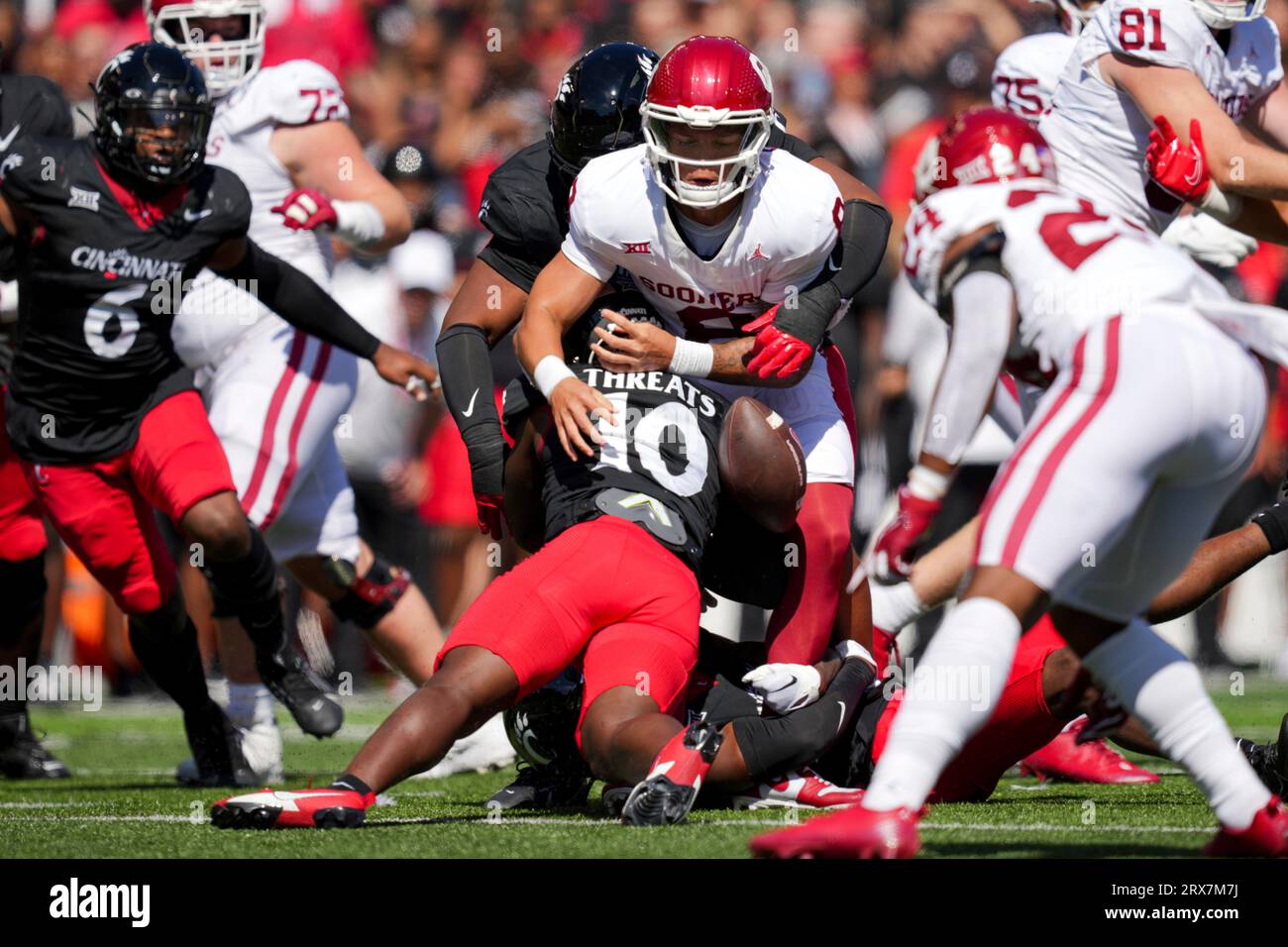 Oklahoma quarterback Dillon Gabriel, center, fumbles the ball as he is ...