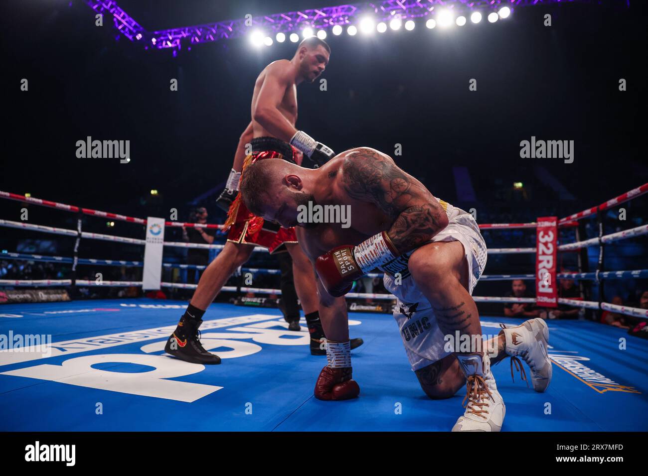 Alberto Tapia is knocked down as the referee starts the count. Tommy ...