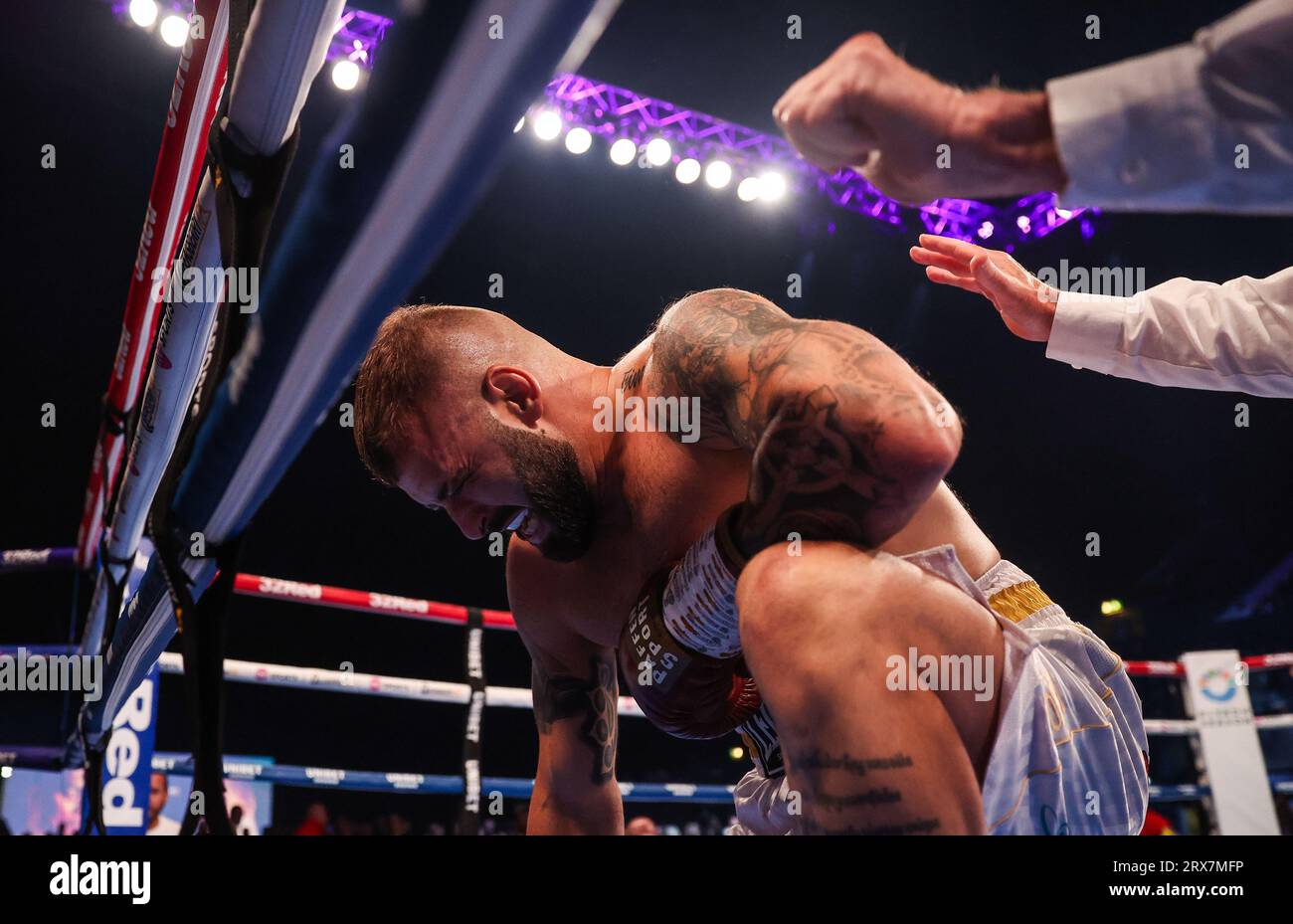 Alberto Tapia is knocked down as the referee starts the count in the ...