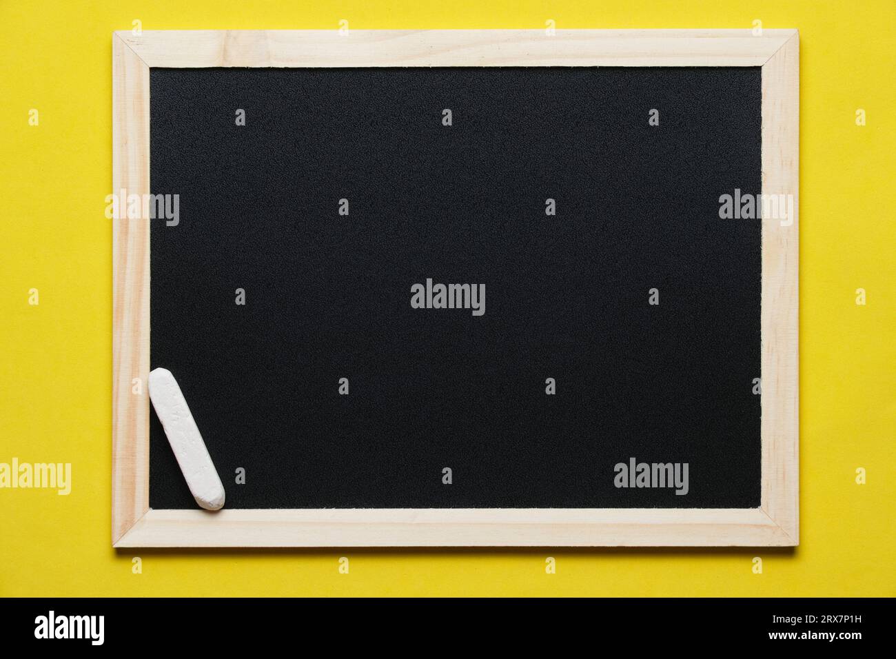 Chalkboard with chalk on bright yellow background Stock Photo - Alamy