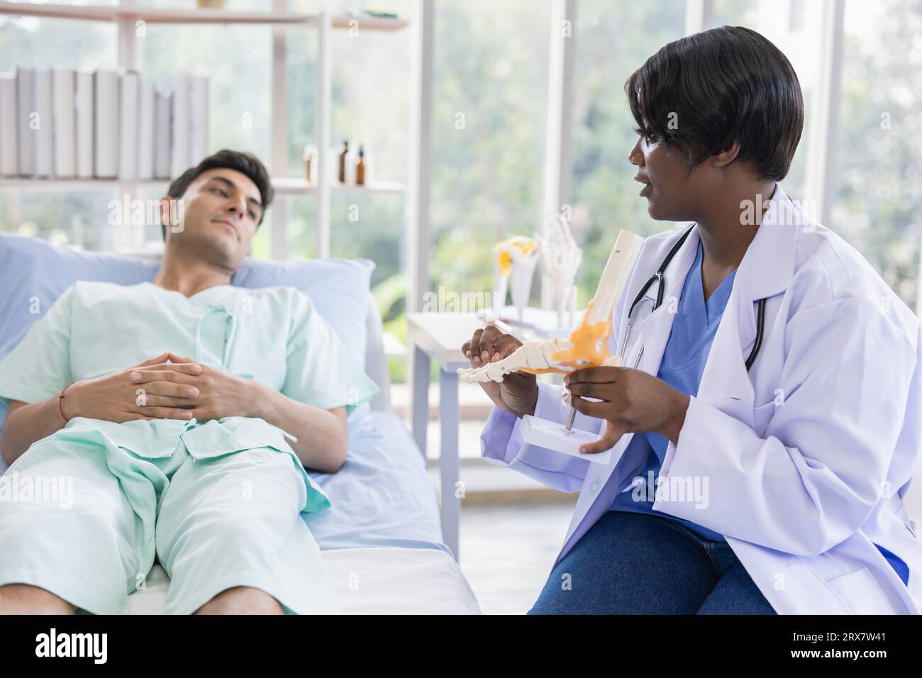 Patient sport male meeting physiotherapist doctor for muscle joint pain ...