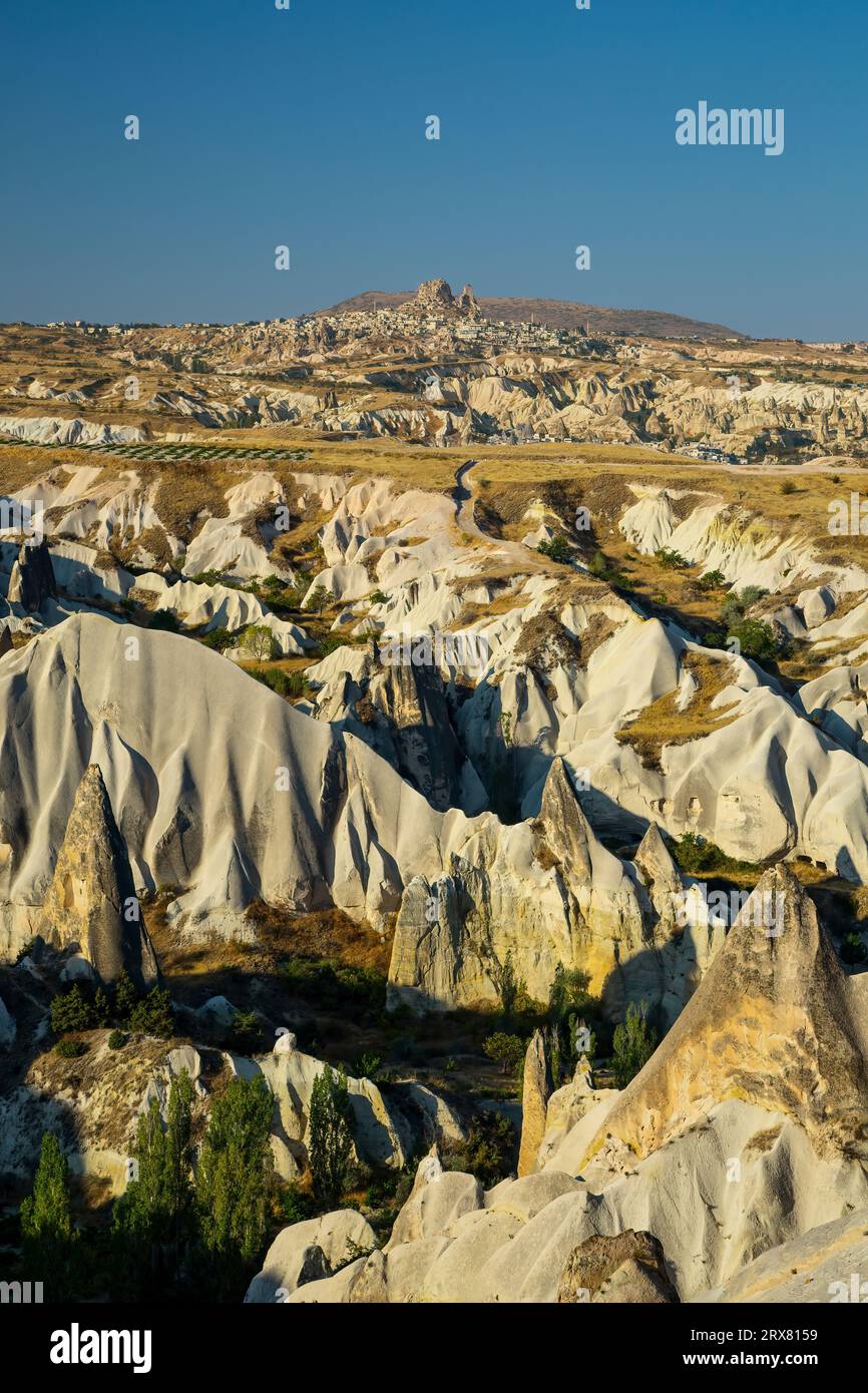 Uchisar (background), fairy chimneys and badlands, from Rose Valley ...