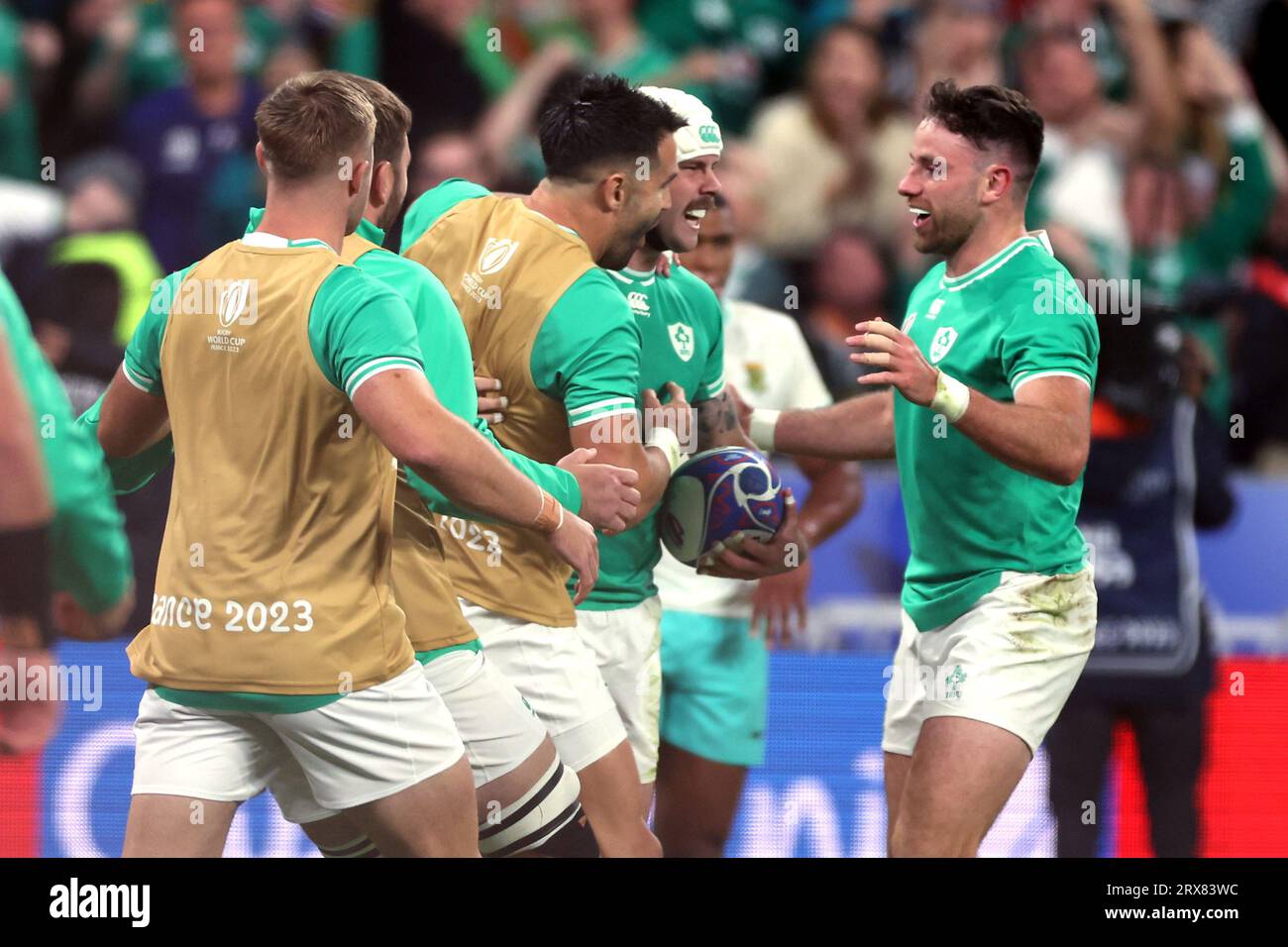 Ireland's Mack Hansen (centre) celebrates scoring his side's first try ...