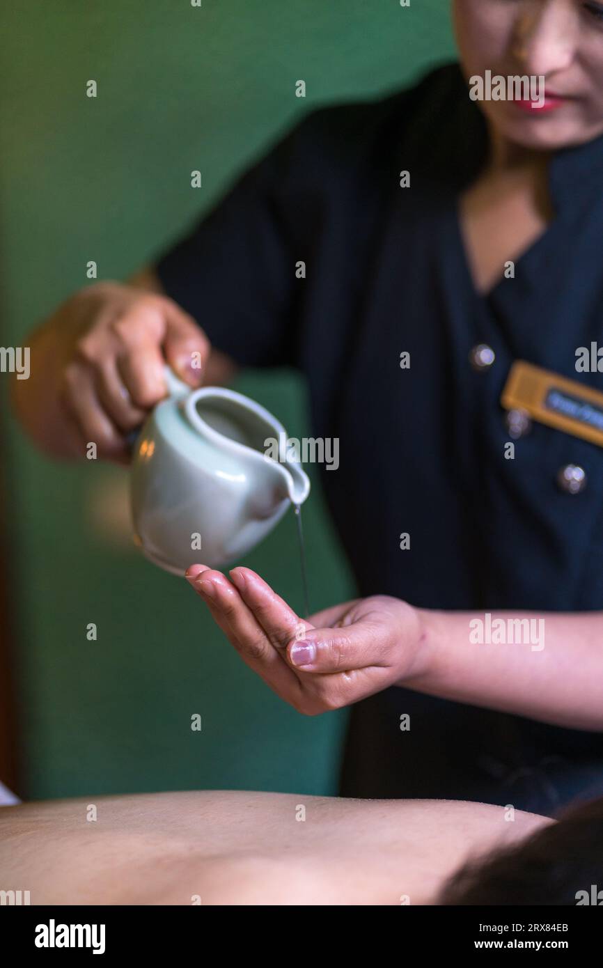 Woman pouring oil hi-res stock photography and images - Alamy