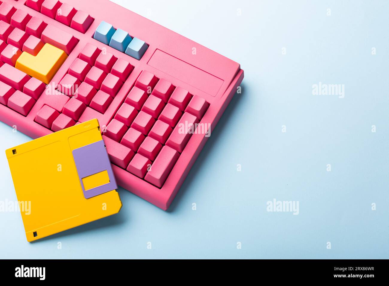 Floppy disks and keyboard on bright colored backgrounds. High quality ...