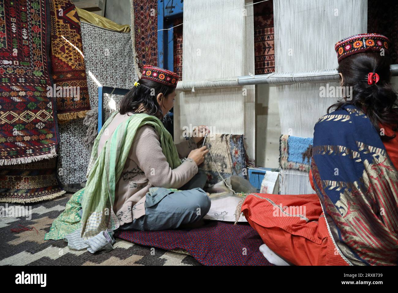 Pakistani carpet weavers at Korgah in the Upper Hunza Stock Photo - Alamy