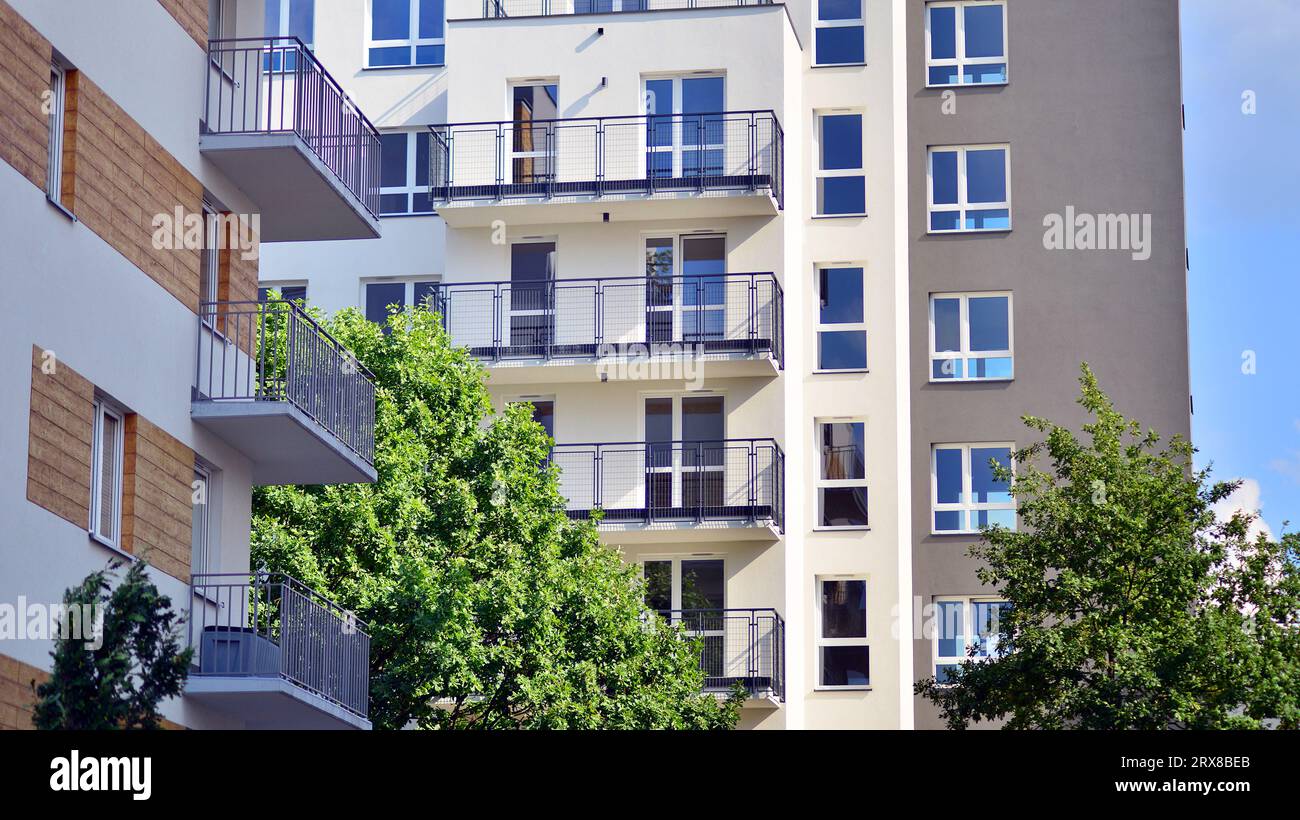 A modern residential building in the vicinity of trees. Ecology and ...
