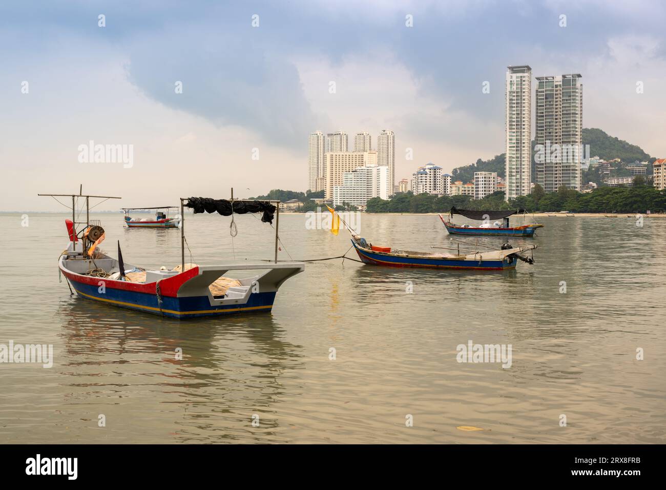 Small Malaysian fishing boats moored on the beach with the Gurney ...