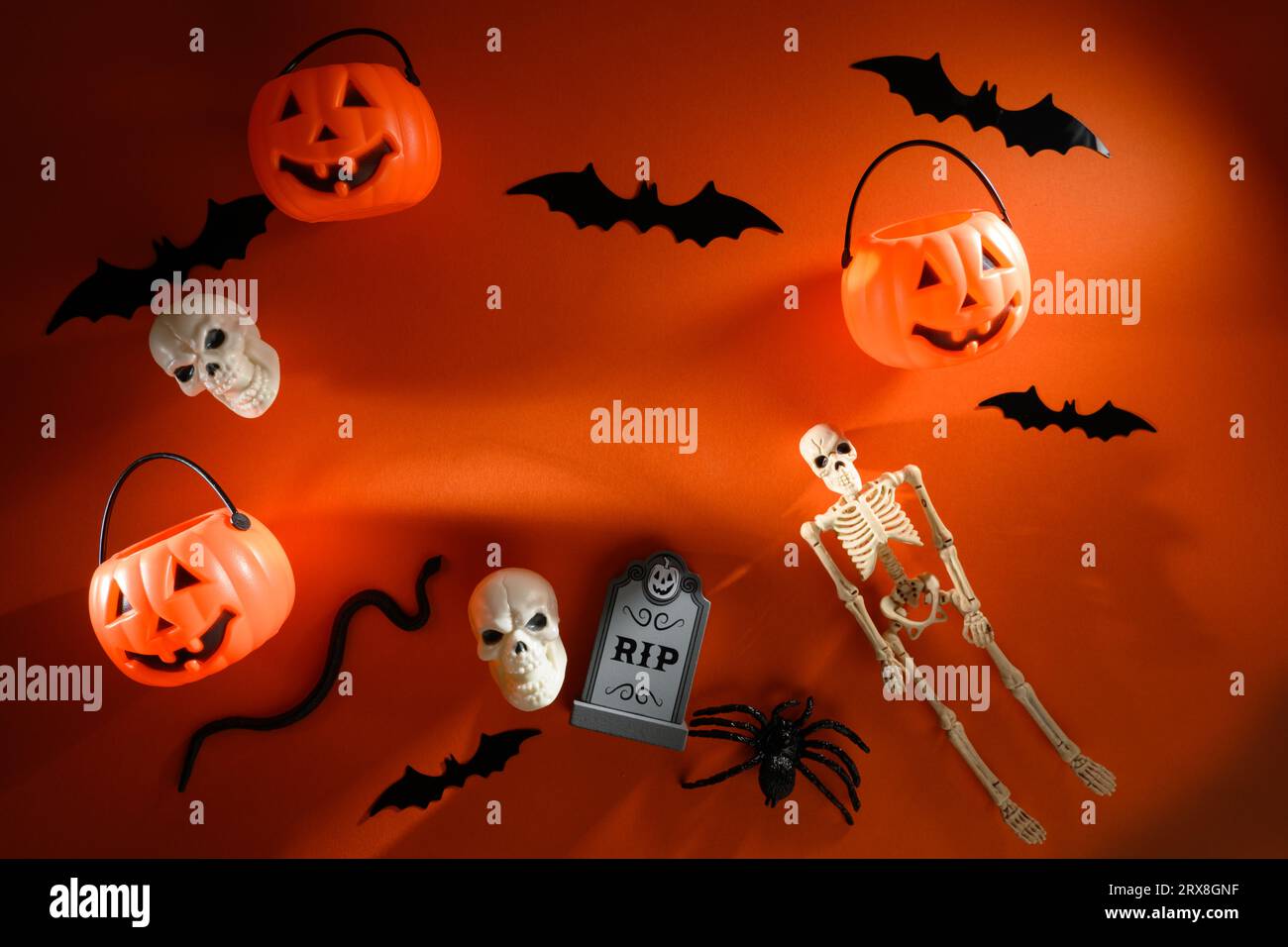 Assorted halloween items. Toys, jack-o-lantern buckets, skeletons ...