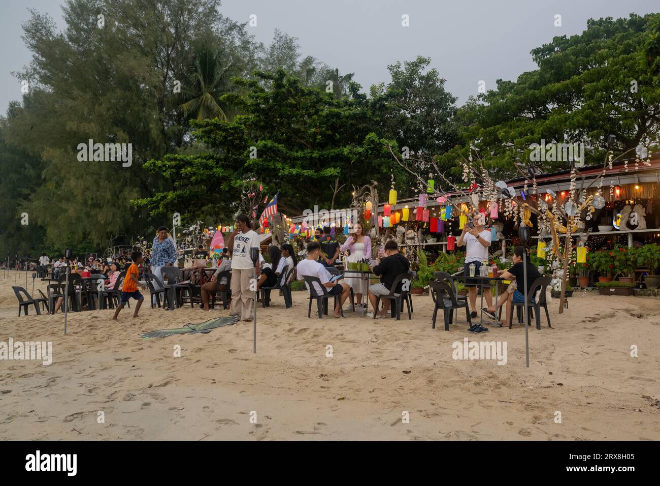 A busy beach bar at sunset, Batu Ferringhi Beach, Penang, Malaysia ...