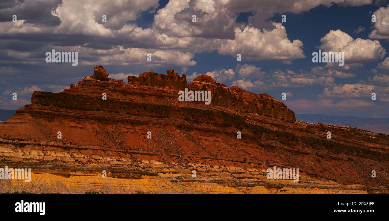 Dreamy cumulus clouds float above Spotted Wolf Canyon in Utah's famous ...