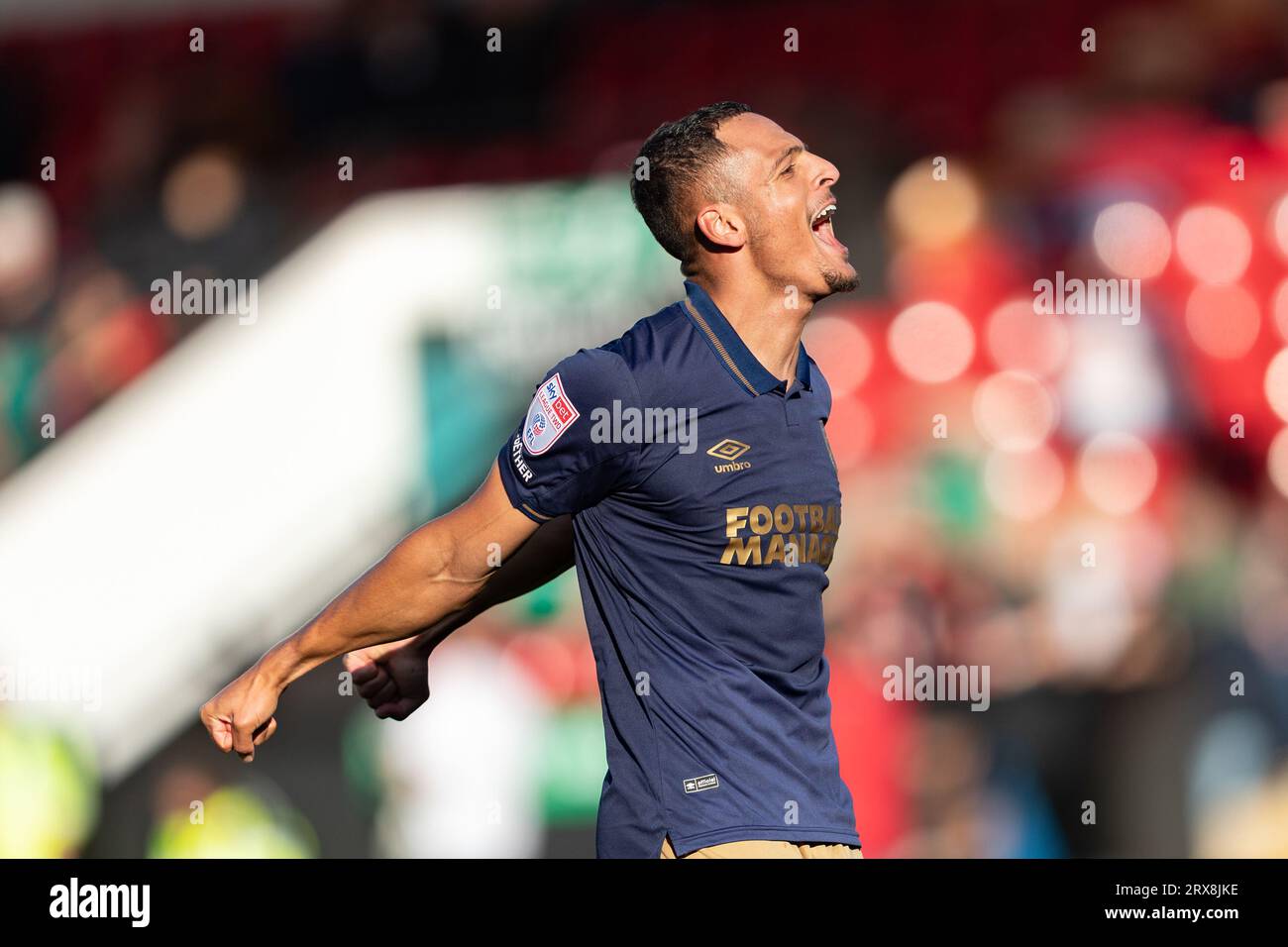 Ali Al-Hamadi of AFC Wimbledon celebrates scoring their side's third ...