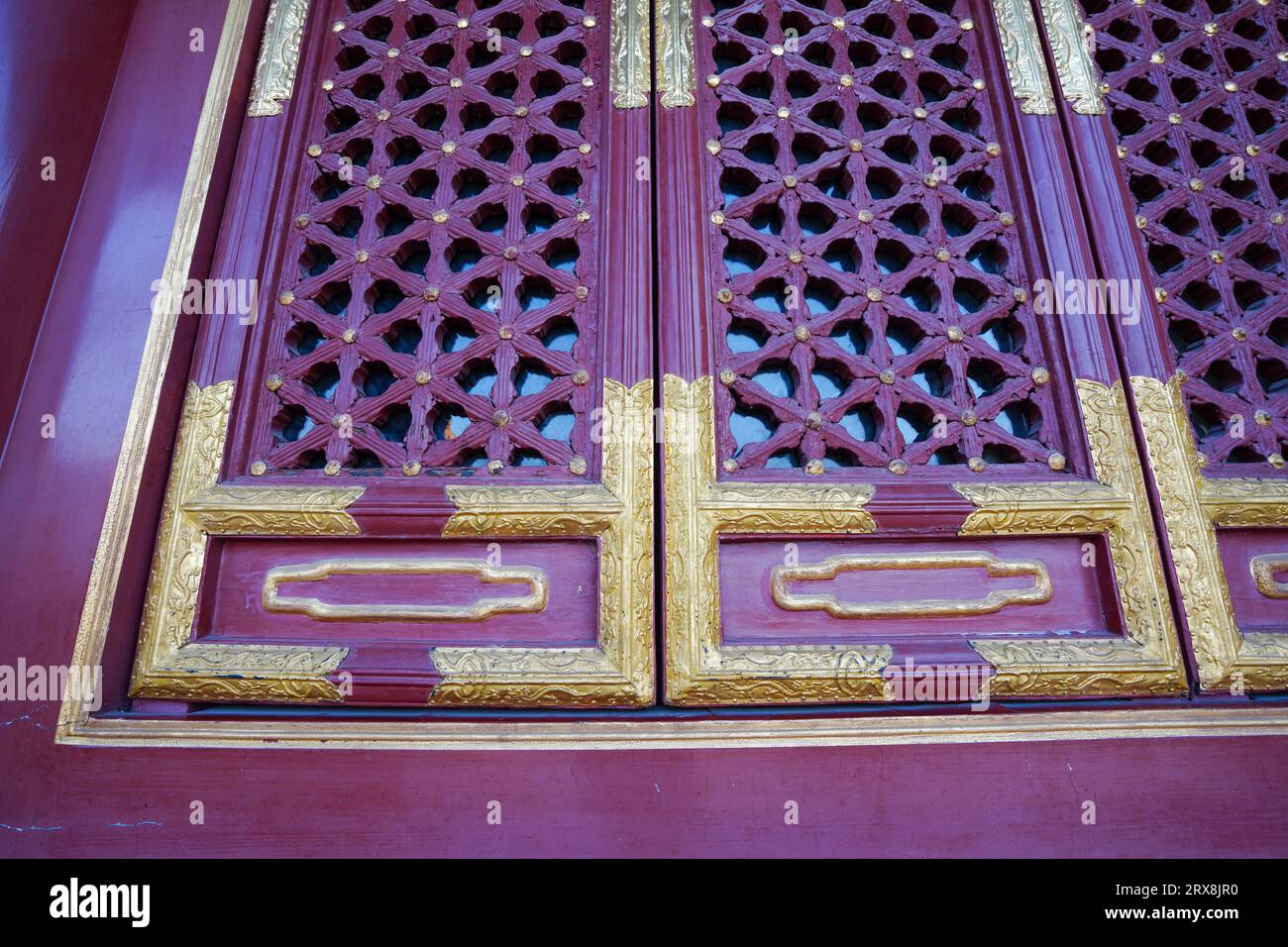 Gilded decoration on wooden windows of Tibetan ancient buildings in ...