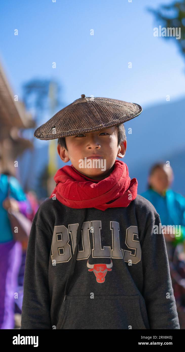 Small boy with bamboo hat portrait in Phobjikha valley of Bhutan during ...