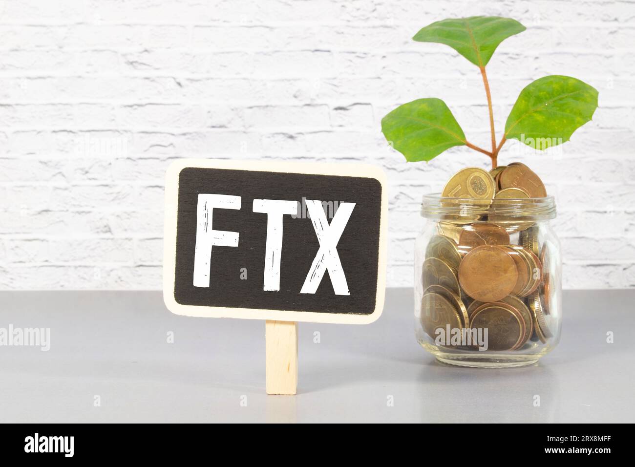 FTX . text on magnifier glass on white background. notepad on the ...