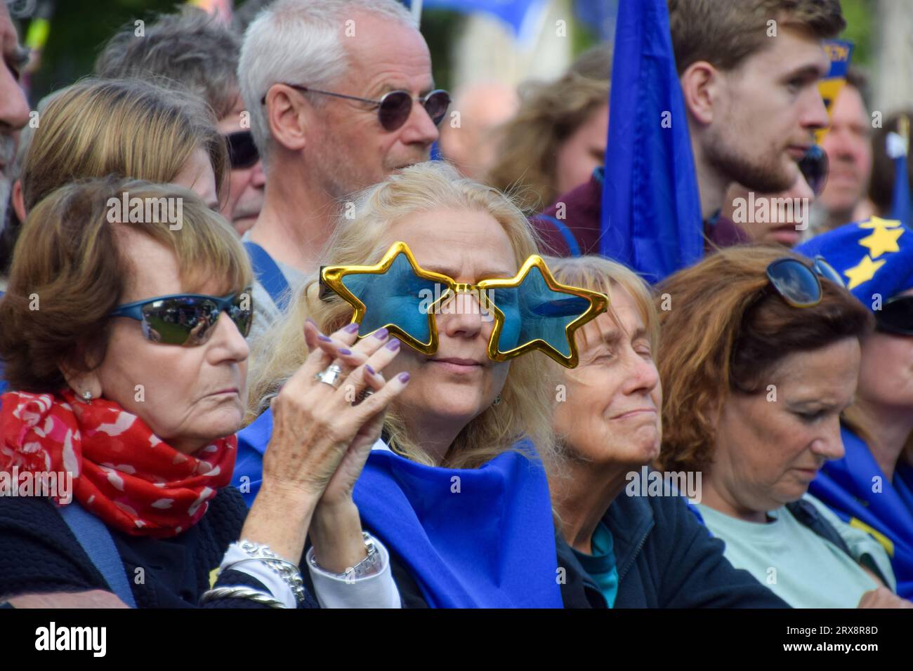 London, UK. 23rd Sep, 2023. A protester wears star-shaped sunglasses ...
