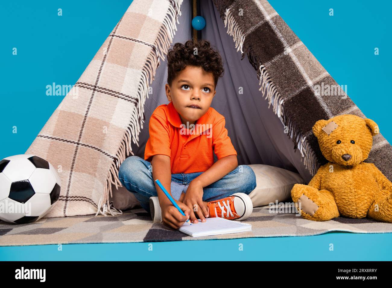 Photo of focused smart kid e learning writing lesson on online zoom ...