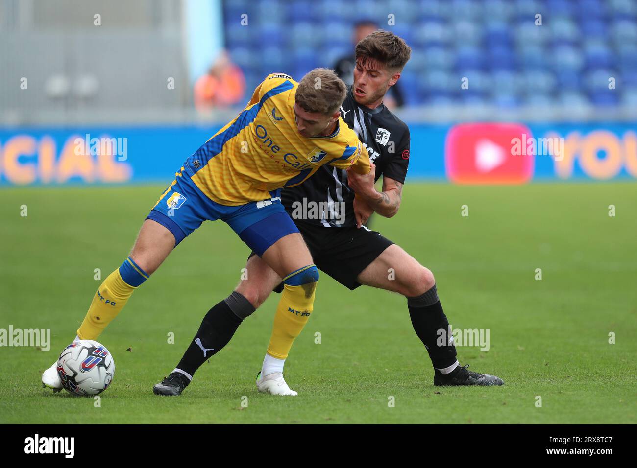 Mansfield Town's Lewis Brunt battles with Barrow's Kian Spence the Sky ...