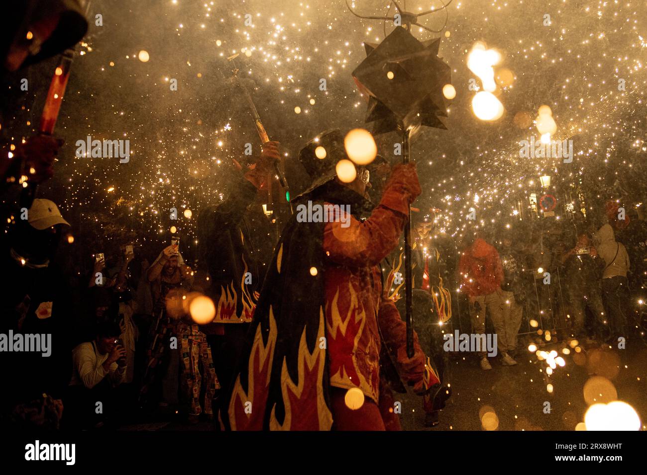 Barcelona, Spain. 23rd Sep, 2023. 'Correfocs' (fire runners) set off ...