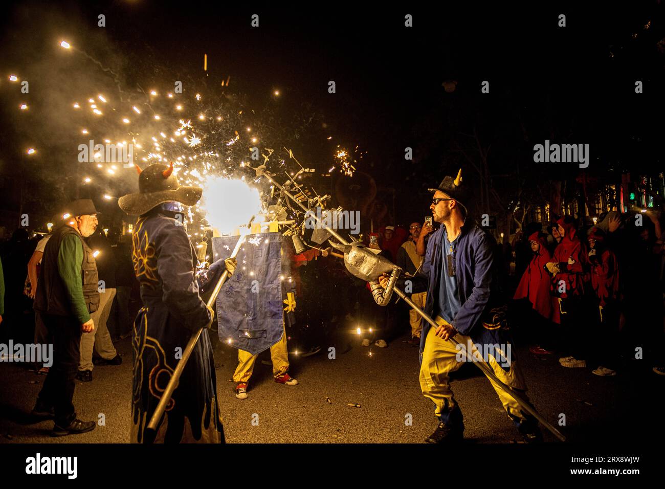 Barcelona, Spain. 23rd Sep, 2023. 'Correfocs' (fire runners) set off ...