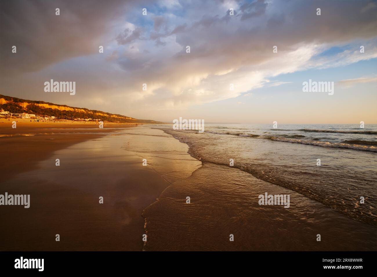 Atlantic ocean sunset with surging waves at Fonte da Telha beach ...