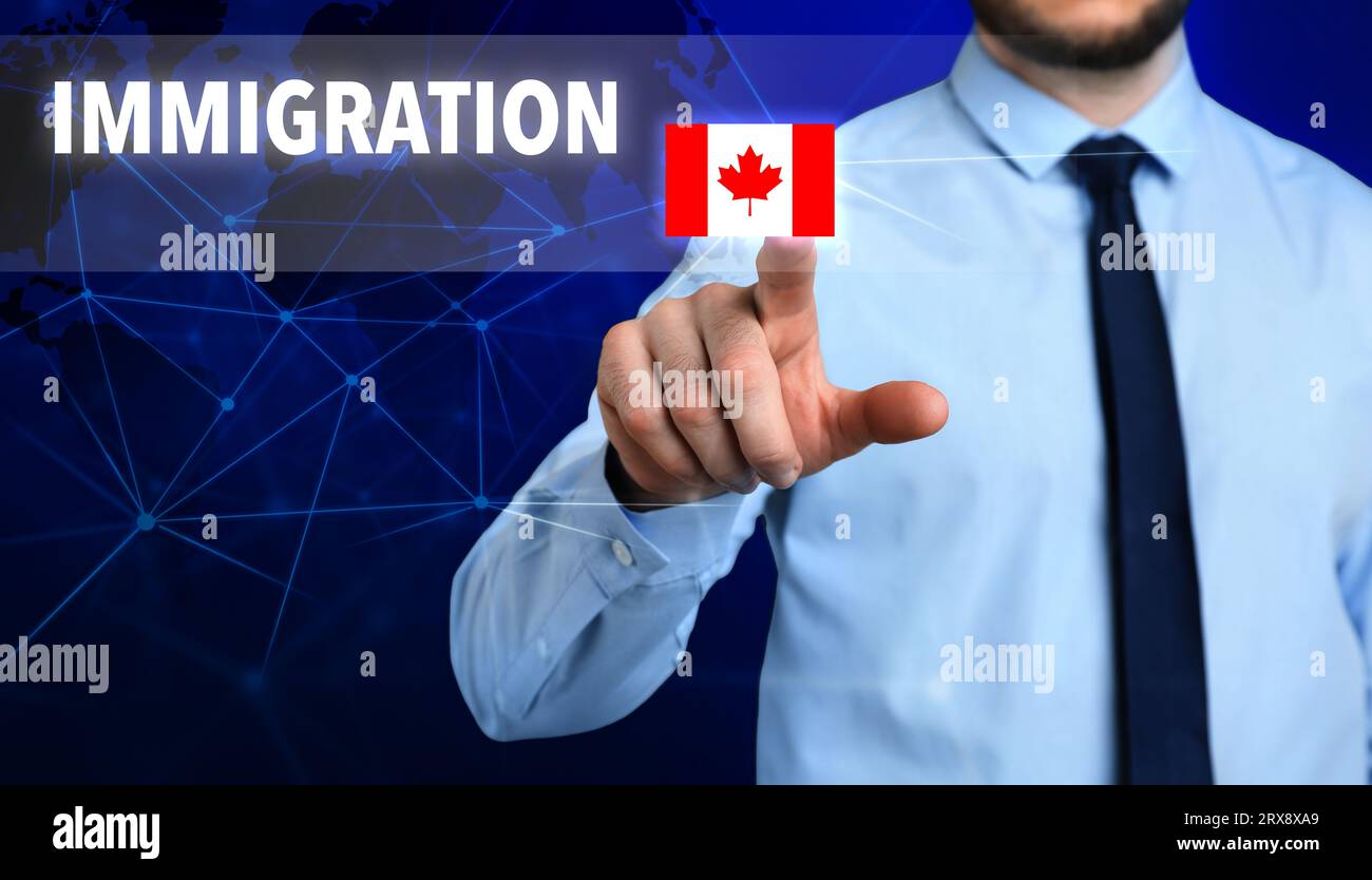 Immigration. Businessman touching digital screen with word and flag of ...