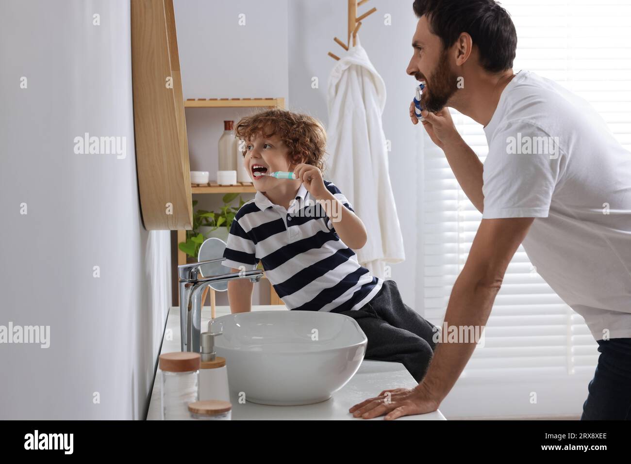 Father brushing teeth in hi-res stock photography and images - Alamy