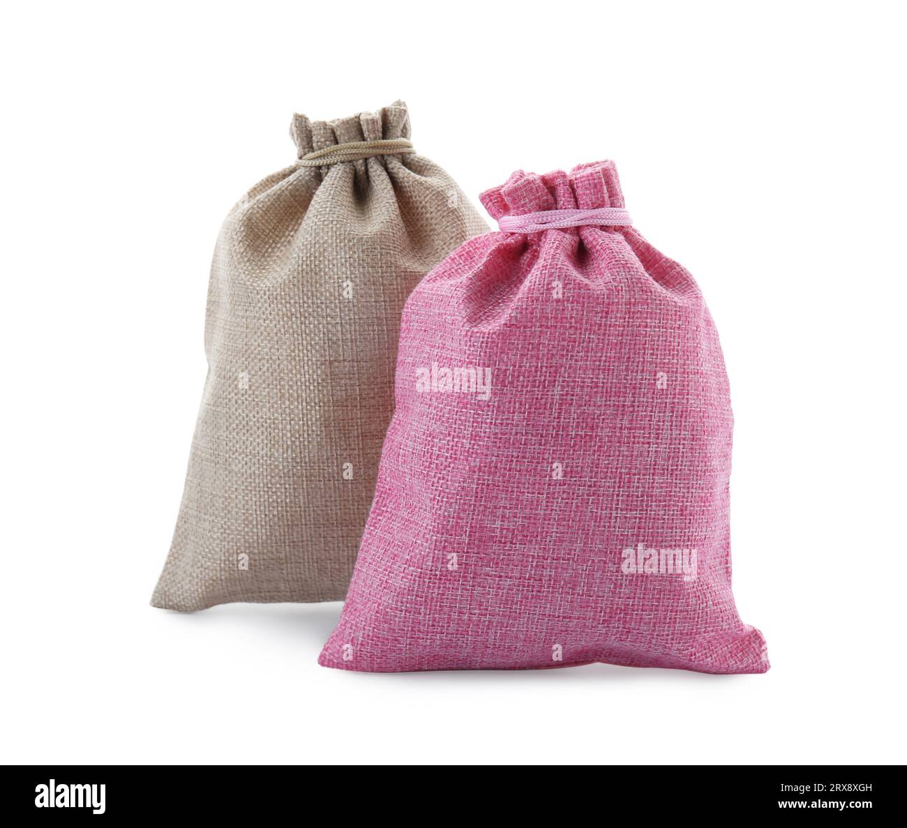 Two tied burlap bags isolated on white Stock Photo - Alamy