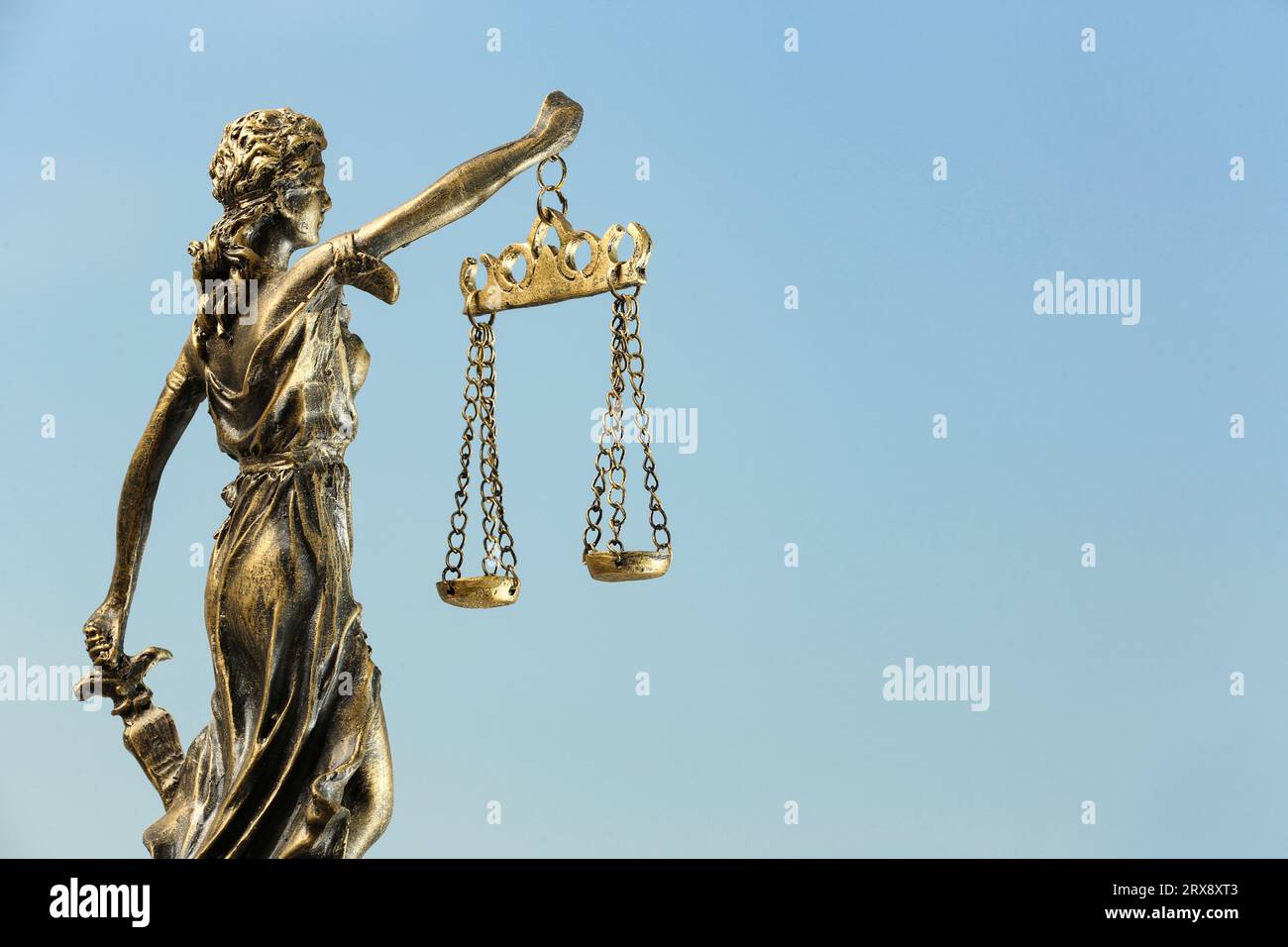 Symbol of fair treatment under law. Figure of Lady Justice against sky ...