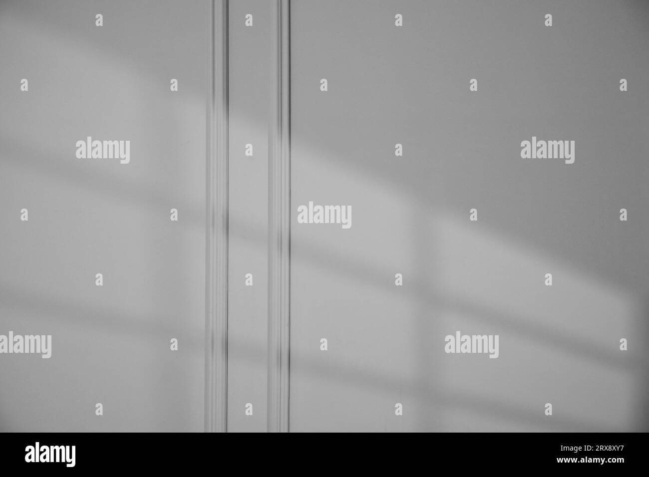 Shadow from window on dark grey wall indoors Stock Photo - Alamy