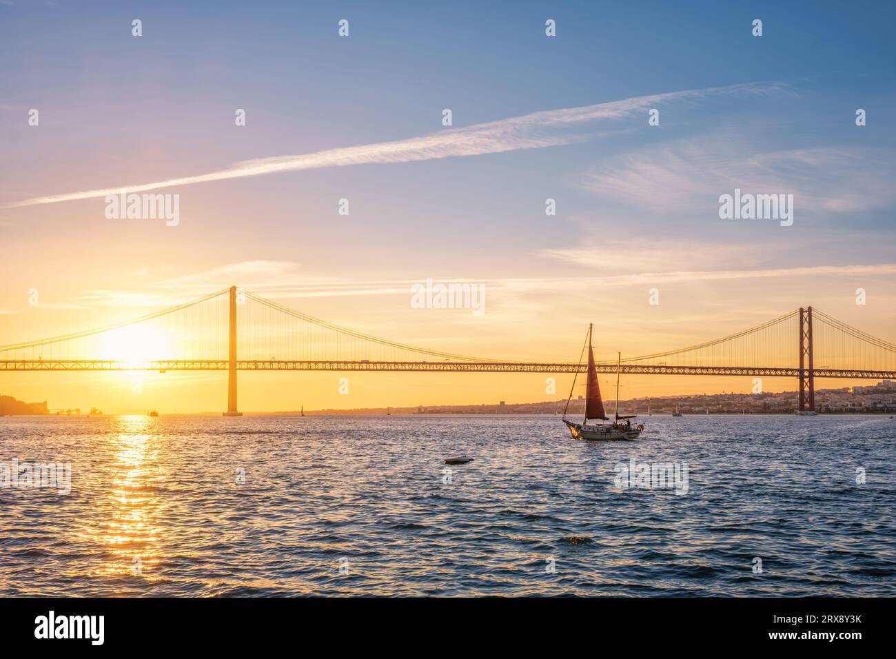 View of 25 de Abril Bridge over Tagus river on sunset. Lisbon, Portugal ...
