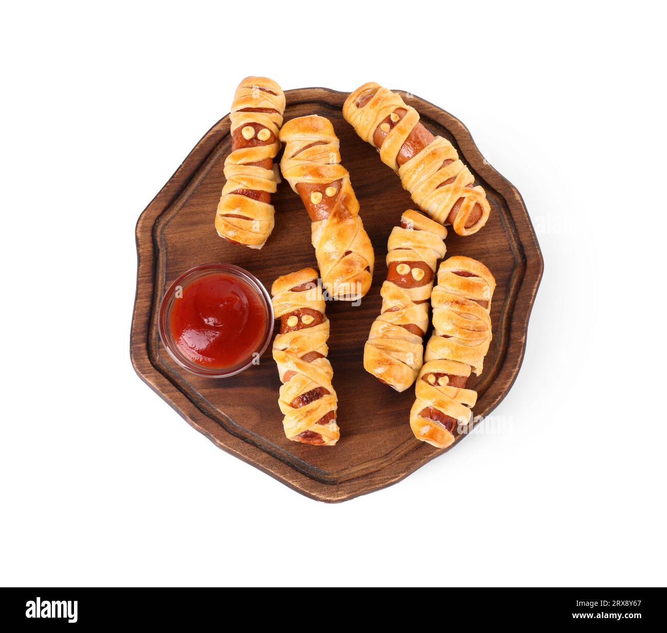 Cute sausage mummies served with ketchup isolated on white, top view ...